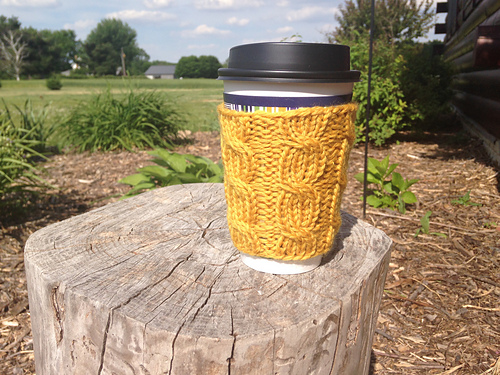 Ravelry: Cabled Coffee Cozy pattern by mrs max