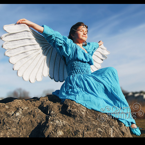 Ravelry: Child Feather Wing Shawl Cape pattern by Megan Lapp