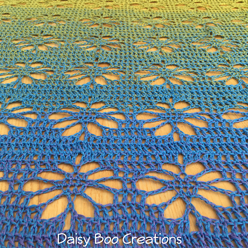 Ravelry: Painted Daisies wrap pattern by Suzy Cowey