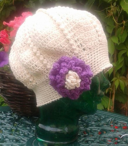 Ravelry: Ladies Hat with Flower pattern by Sonya Gibbons