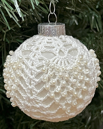 Ravelry: Pineapple Lace Ornament Cover pattern by Emma Garside