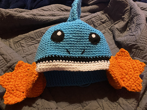 Ravelry: Mudkip Earflap Hat pattern by Melissa Cook