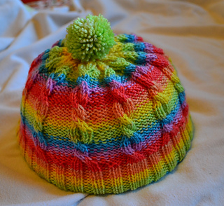 Ravelry: Childish Cables Stocking Cap pattern by Grid Mammal Crafts