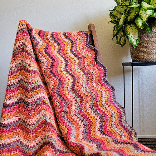 Ravelry: Huzzah Cluster Ripple Blanket pattern by Jennifer Olivarez