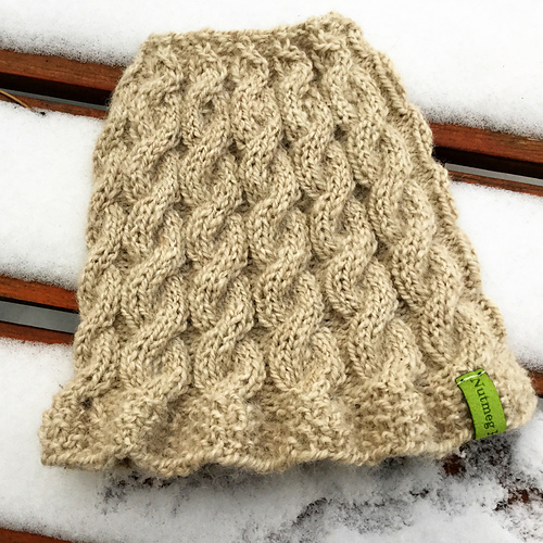 Ravelry: The Charlotte Cable Bun Beanie pattern by Noelle Davis