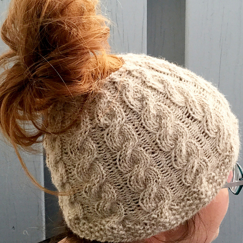 Ravelry: The Charlotte Cable Bun Beanie pattern by Noelle Davis