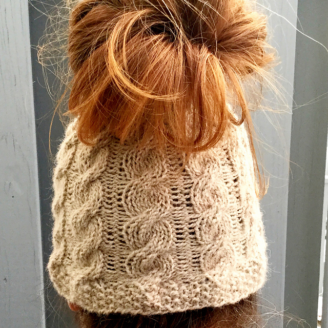 Ravelry: The Charlotte Cable Bun Beanie pattern by Noelle Davis