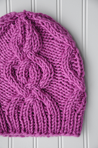 Ravelry: Cable Cross Hat pattern by Universal Yarn