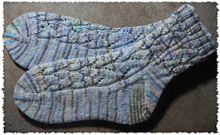 Ravelry: Mock Cable Lacy Toe Up Socks pattern by Wilma Becker