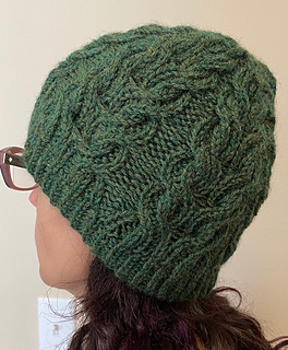 Ravelry: Fun Reversible Cables Hat pattern by Anna Singur