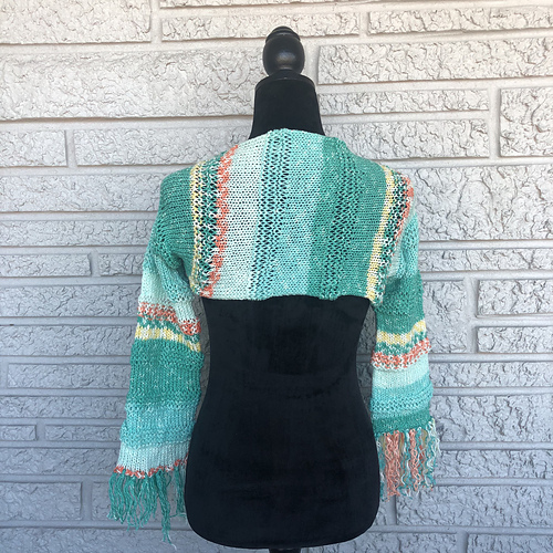 Ravelry: Minty Fringe Shrug pattern by Loom Knit Designs with BOHLD