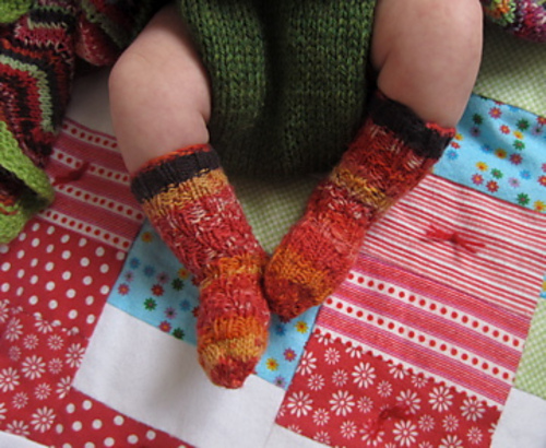 Ravelry: Newborn Spiral-Rib Tube Sock pattern by Jessi Crum
