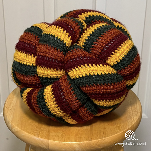 Ravelry: Striped Knot Pillow pattern by Heather Stagl