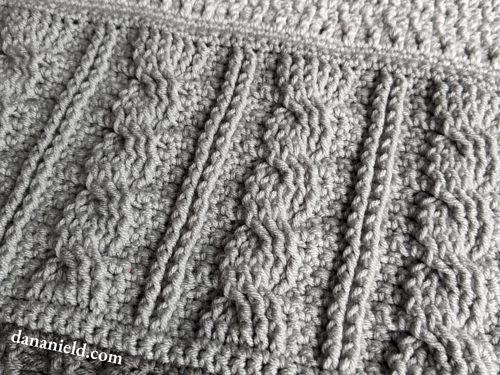 Ravelry: Woven Cables Panel Crochet Baby Blanket pattern by Dana Nield