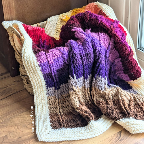 Ravelry: Jacob’s Colorful Cables Crochet Baby Blanket pattern by Dana Nield