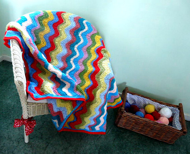 Ravelry: Cheerful Ripple Blanket pattern by Jules Woolford