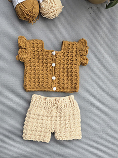 Ravelry: Toasted Marshmallow Baby Top pattern by Susanna Biaye