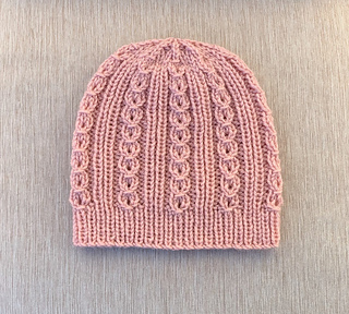 Ravelry: Hat with Small Eyelet Mock Cables pattern by Yelena Chen