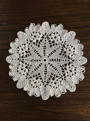 Ravelry: Autumn Marigolds Doily pattern by Josie Rabier