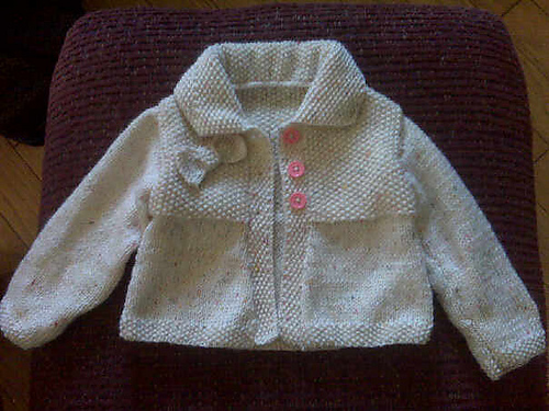 Ravelry: Moss Stitch Cardigan with Bow pattern by Sirdar