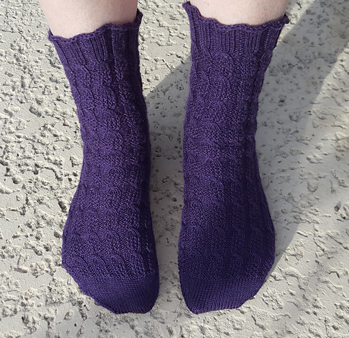 Ravelry: Raspberry Twist Socks pattern by Kristina