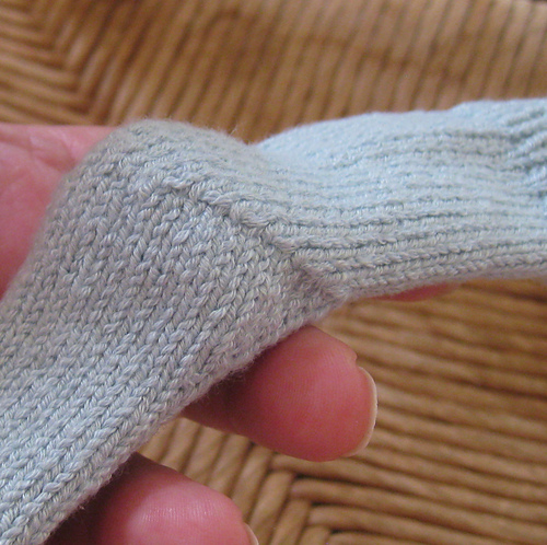 Ravelry: Braided Cable Baby Socks pattern by Mary Henninger