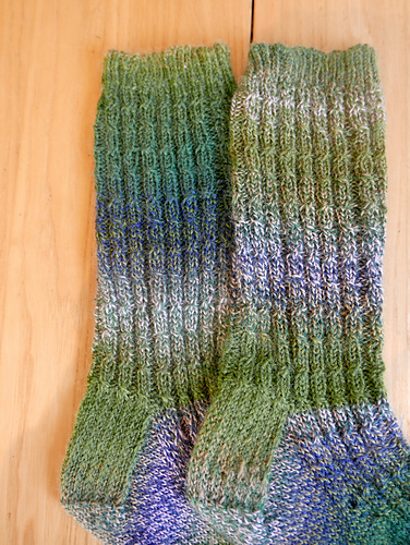 Ravelry: Twisty Mock Cable Socks pattern by Jess McCaughey