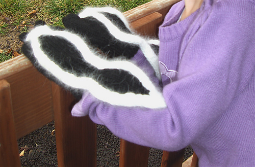 Ravelry: Little Skunk Mitts pattern by Susan Isbell