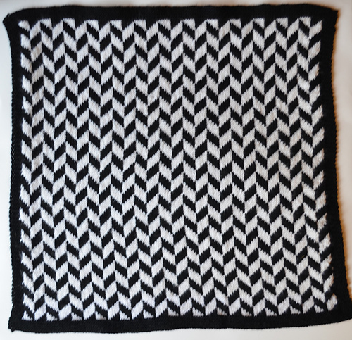 Ravelry: White on Black Half-chevron Baby Blanket pattern by Teresa Boyer